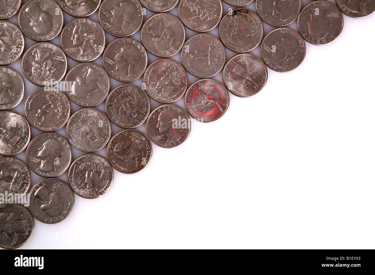 American quarter dollar coins arranged in a triangular formation group ...