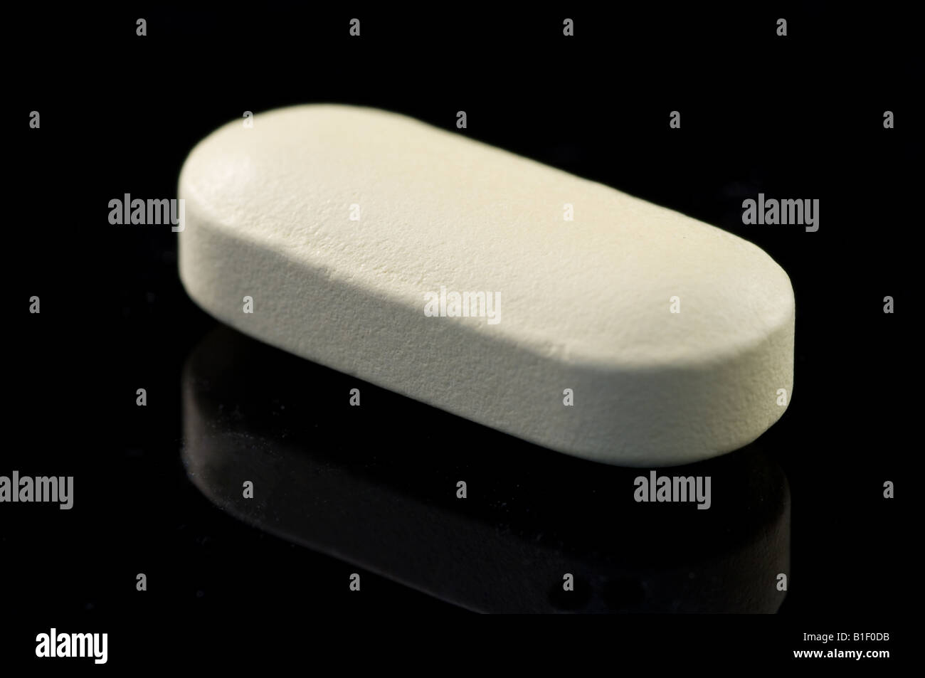 A single Capsule on a black background Stock Photo - Alamy