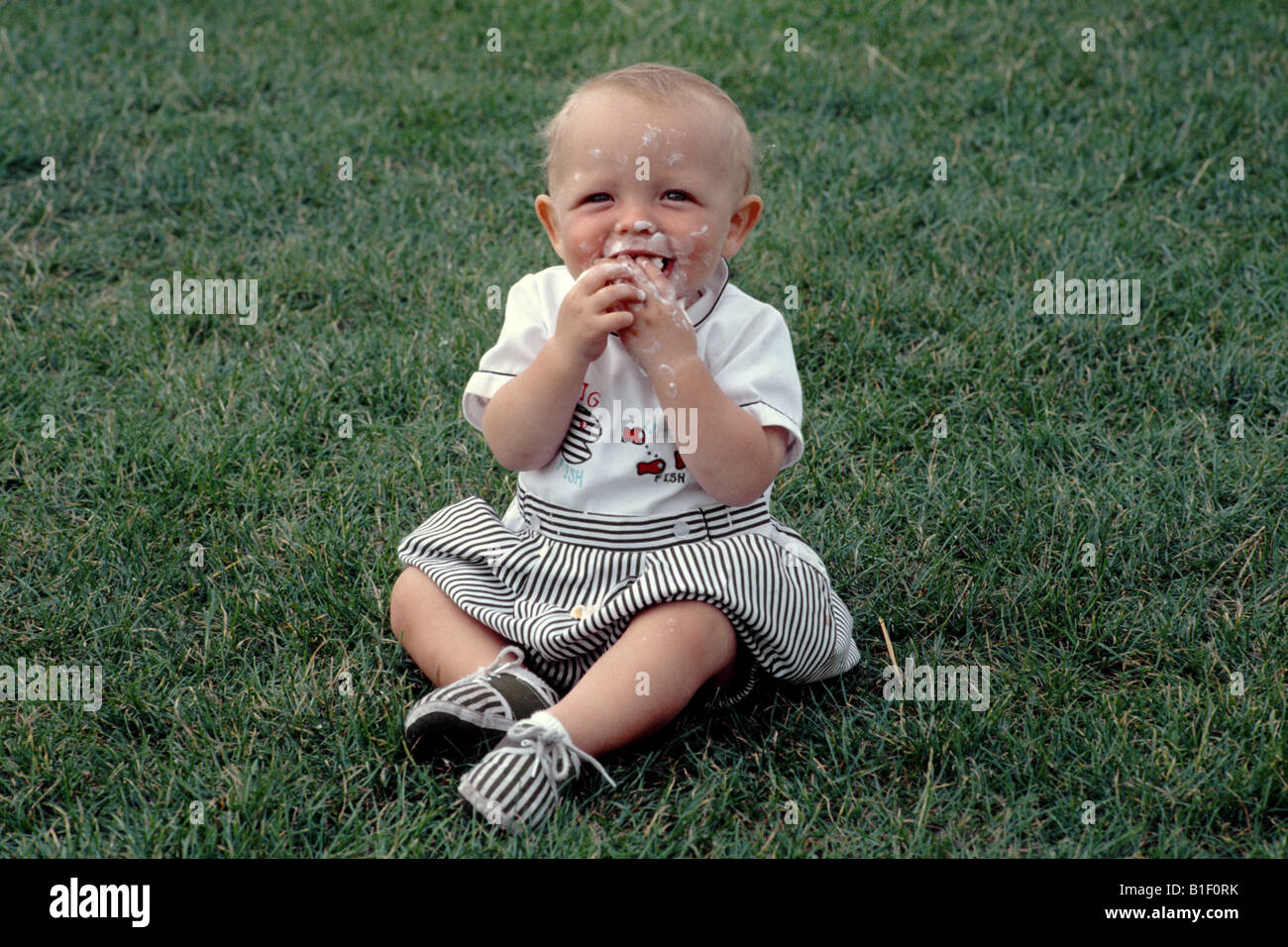 Baby eating ice cream Stock Photo - Alamy