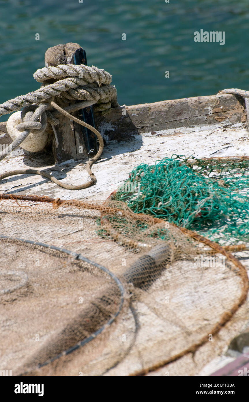 small fisherman boat with nets and traps Stock Photo - Alamy