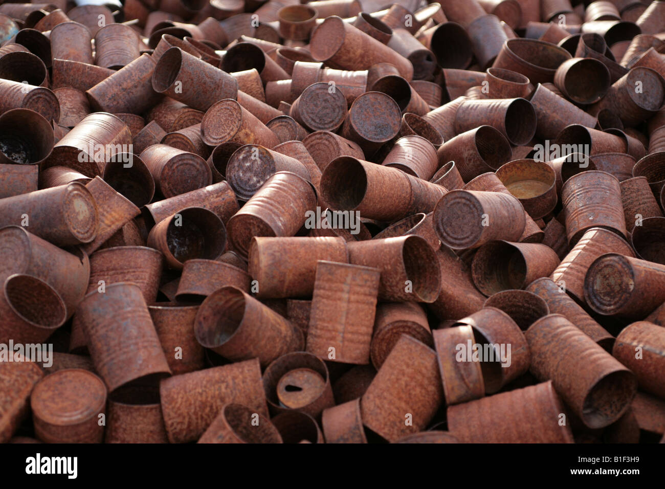 Old pile of rusty food cans in a trash dump Stock Photo - Alamy