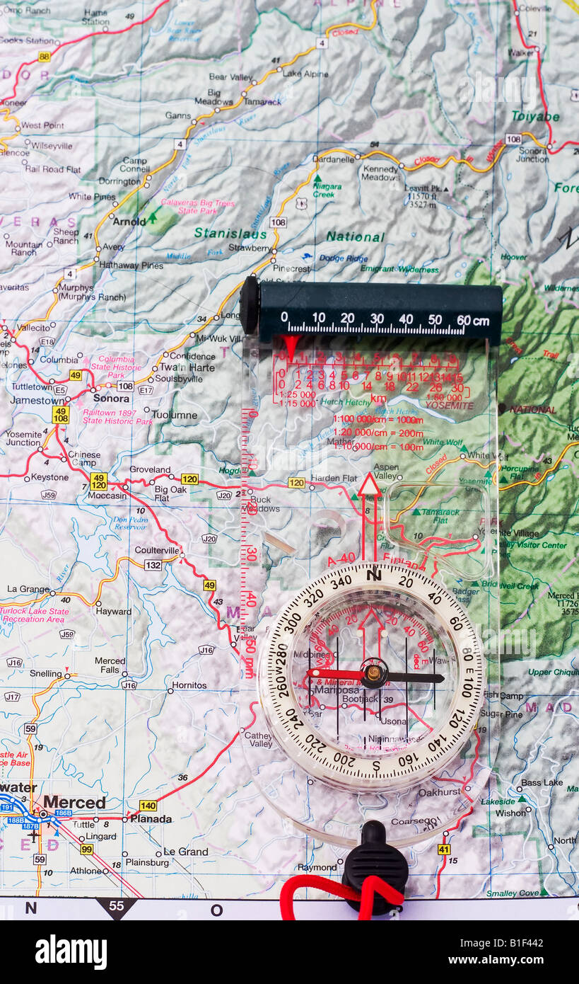 modern compass with map in background Stock Photo - Alamy
