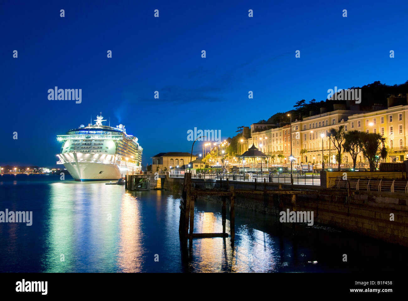 A night time view of a giant cruise ship docked at Cobh deep water ...