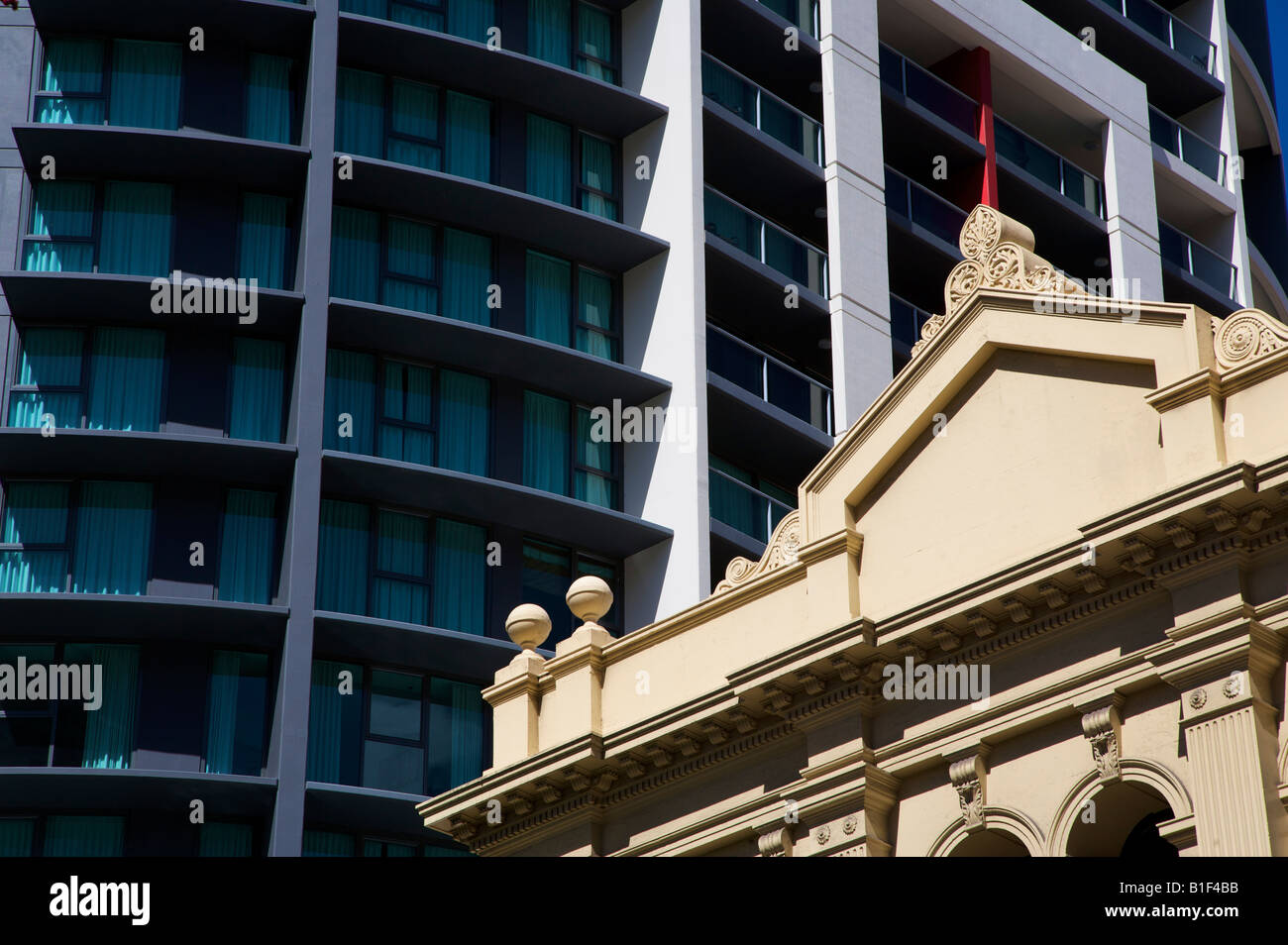 Old colonial building in front of new apartment building Brisbane ...