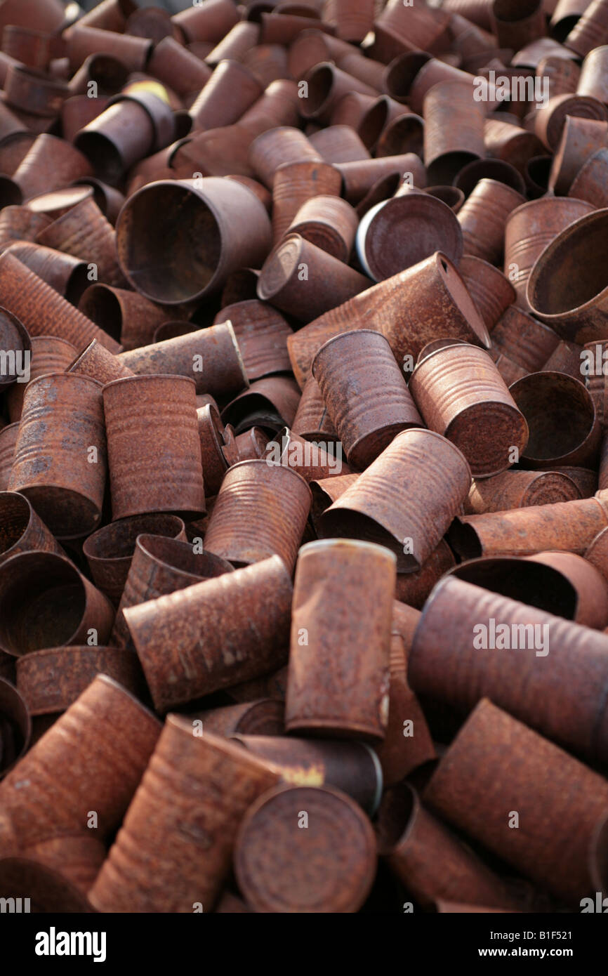 Old pile of rusty food cans in a dump Stock Photo - Alamy