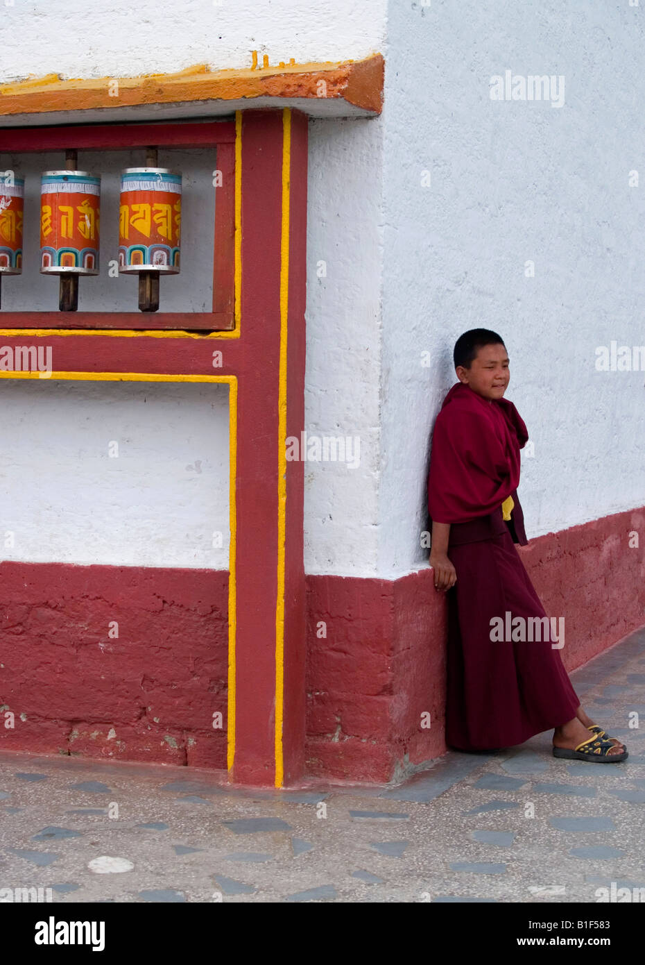 monk resting against a wall at the Phodong Monastery in Sikkim Stock ...