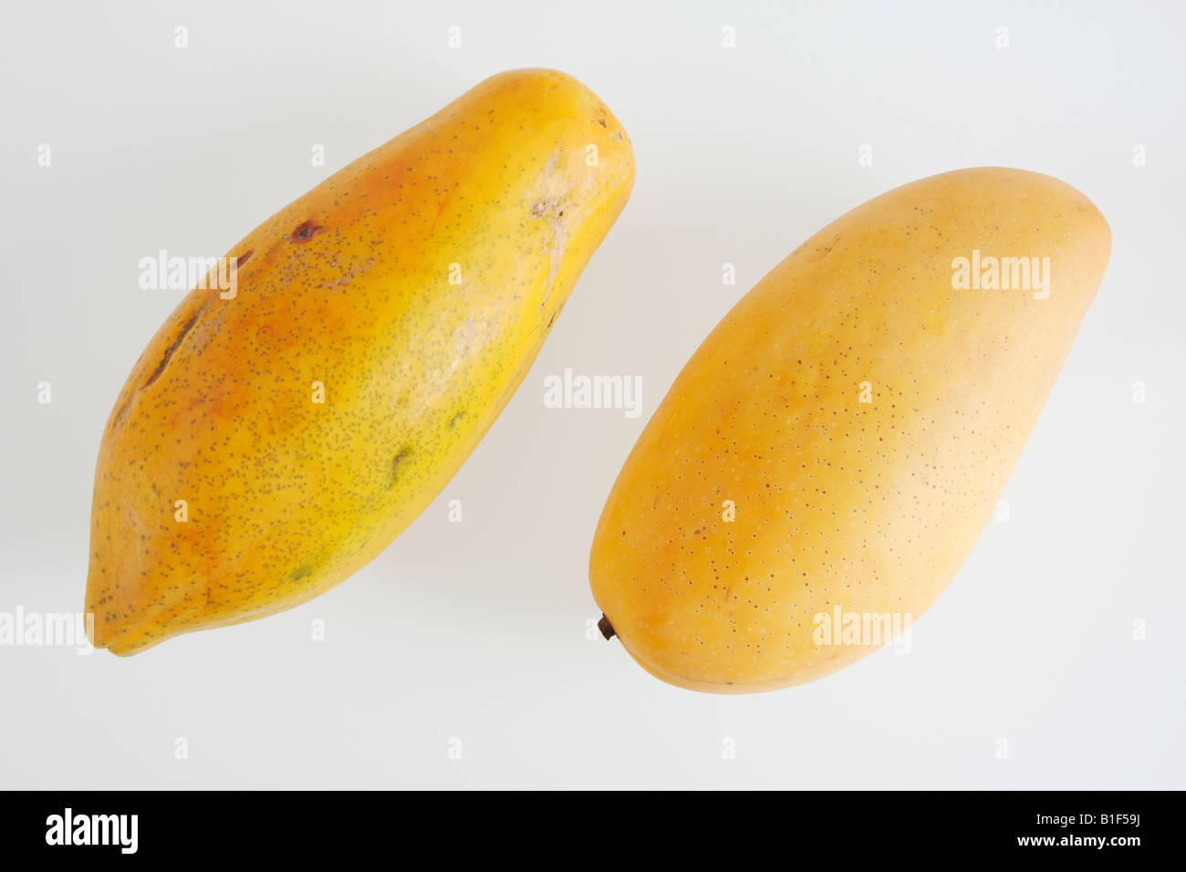 Mango And Papaya On White Background In Studio Stock Photo - Alamy