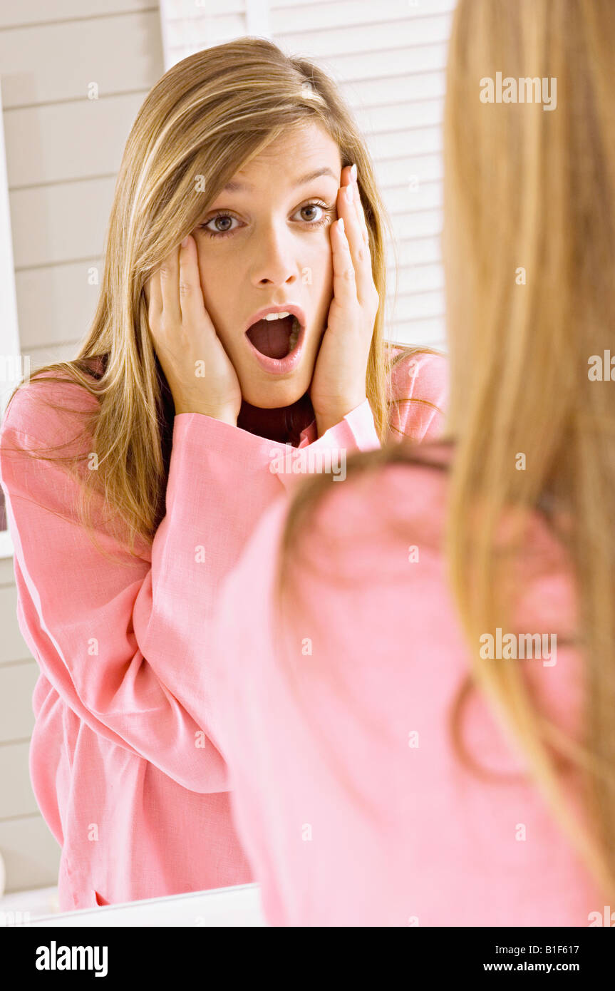 Shocked looking in mirror hi-res stock photography and images - Alamy