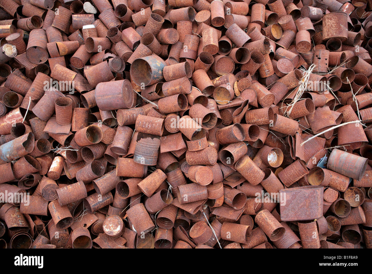 Old pile of rusty cans containers in the garbage Stock Photo - Alamy