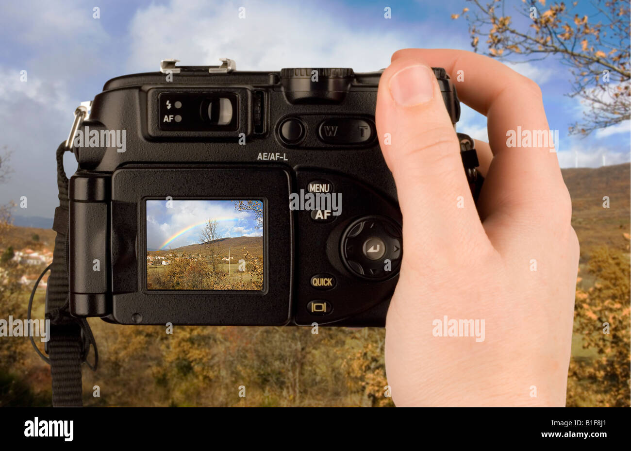 Digital Camera photo in a hand isolated on withe background lcd screen ...
