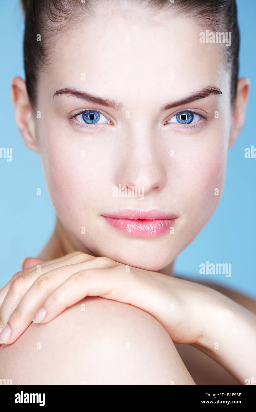 Portrait of young woman with hand on shoulder Stock Photo - Alamy