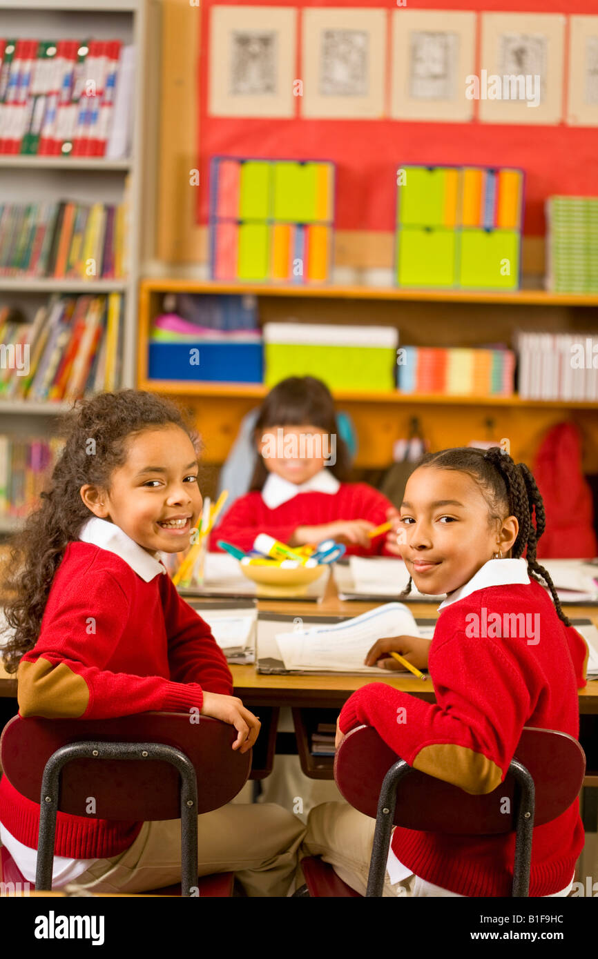 Multi-ethnic girls in classroom Stock Photo - Alamy