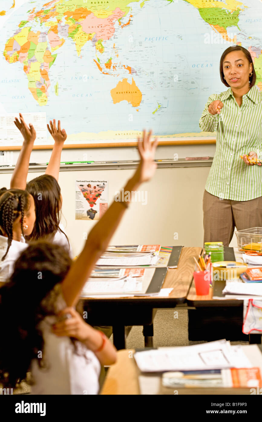 African female teacher calling on student Stock Photo - Alamy