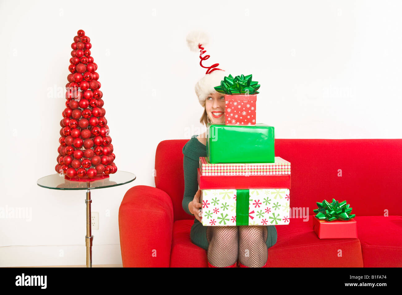 Woman holding stack gift hi-res stock photography and images - Alamy