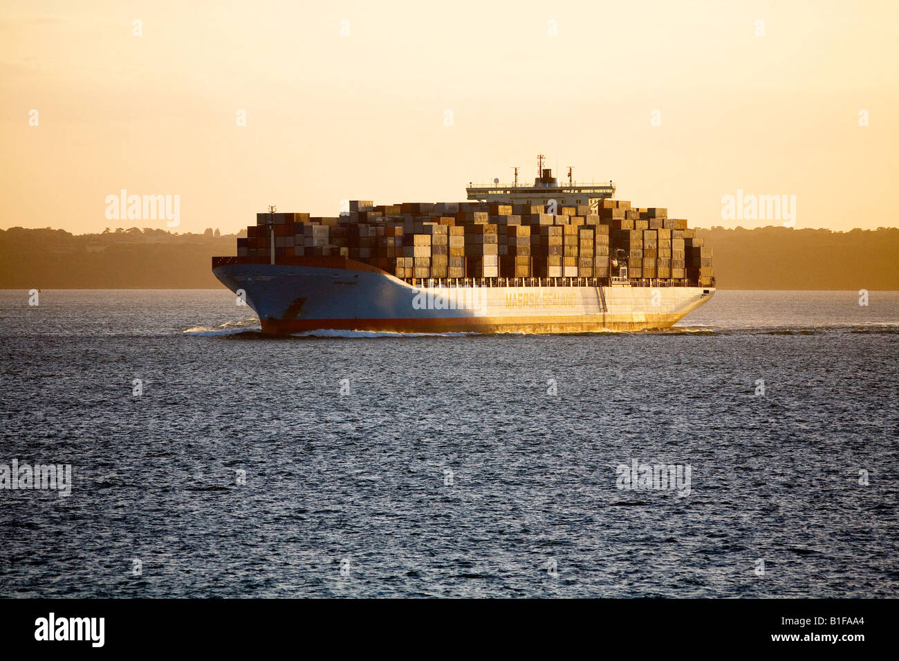 Container ship at sunset Stock Photo - Alamy
