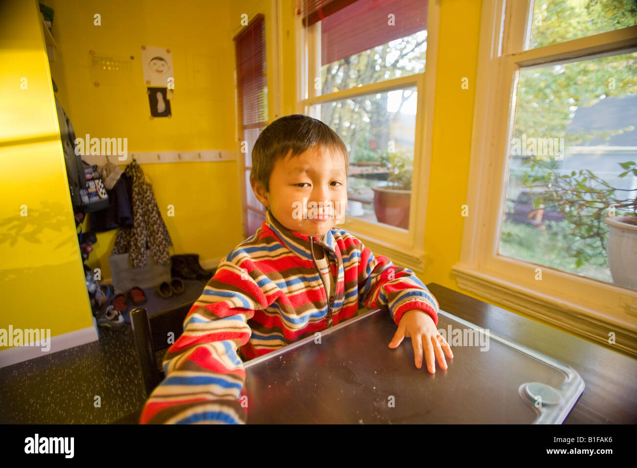 Boy sitting seated hi-res stock photography and images - Alamy