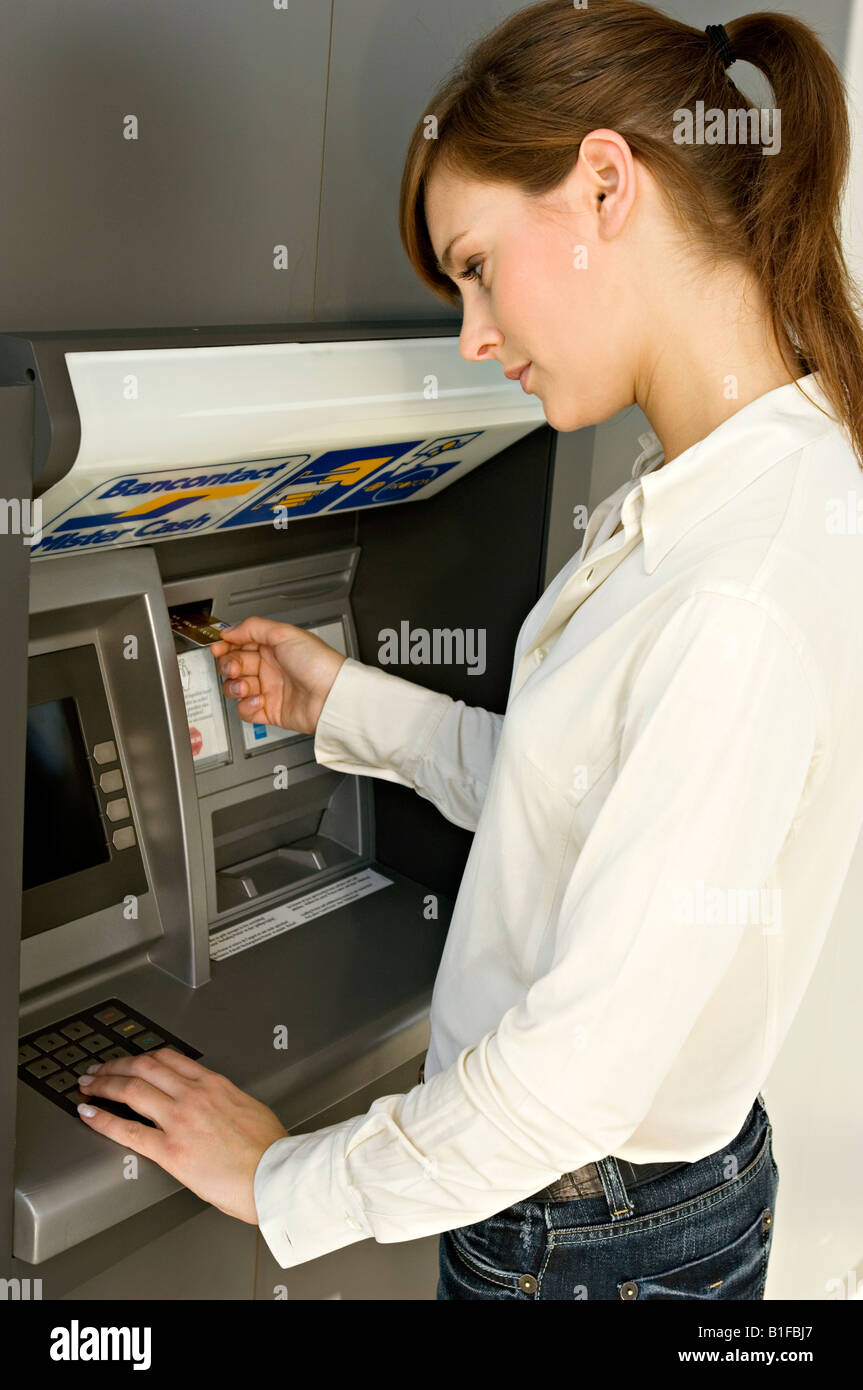Side profile of a businesswoman using an ATM Stock Photo - Alamy