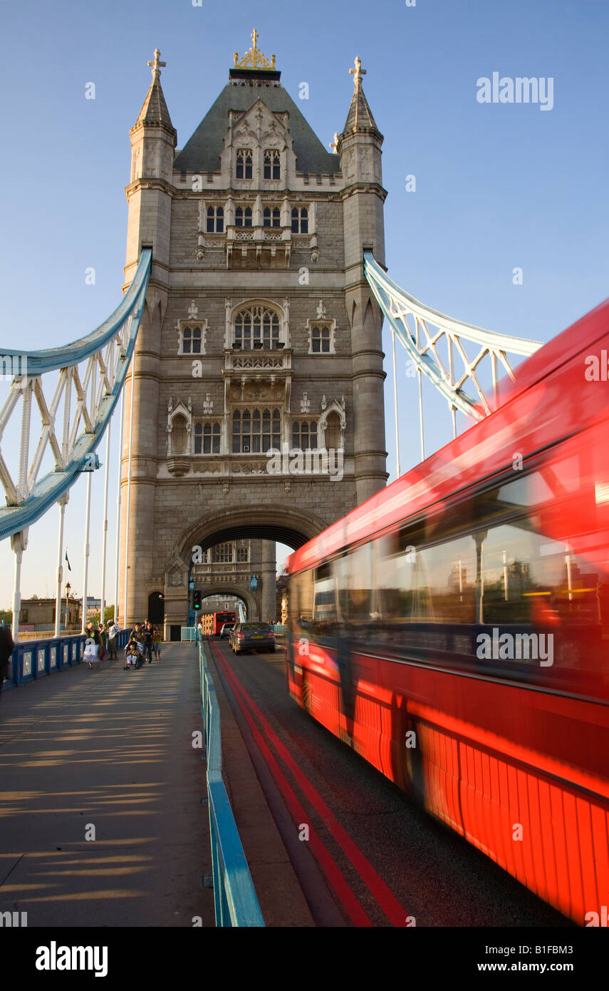 Red bus going over Tower Bridge in London Stock Photo - Alamy