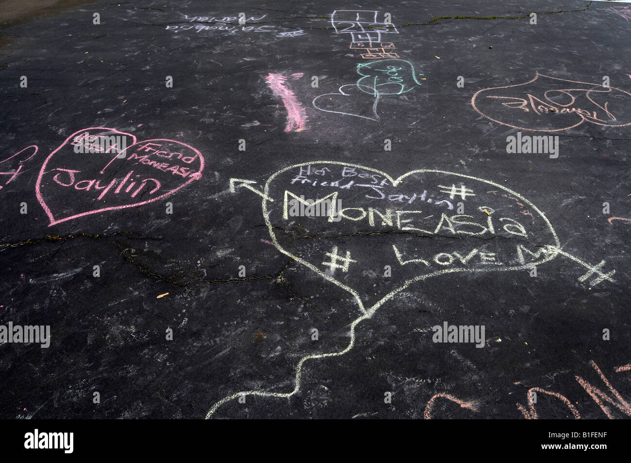 Chalk graffiti in a parking lot Stock Photo - Alamy