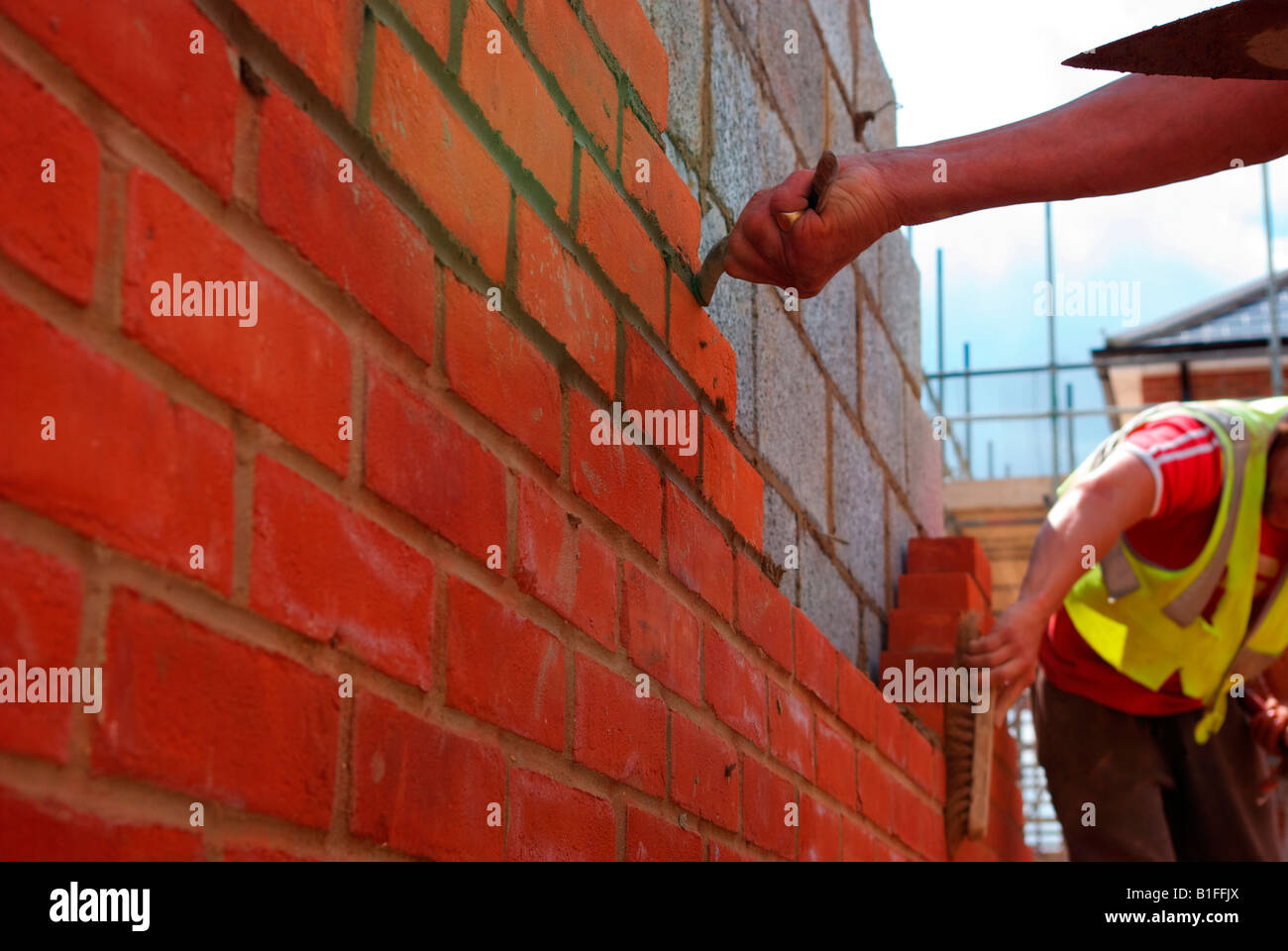 Bricklayers working on large housing development in south east england ...