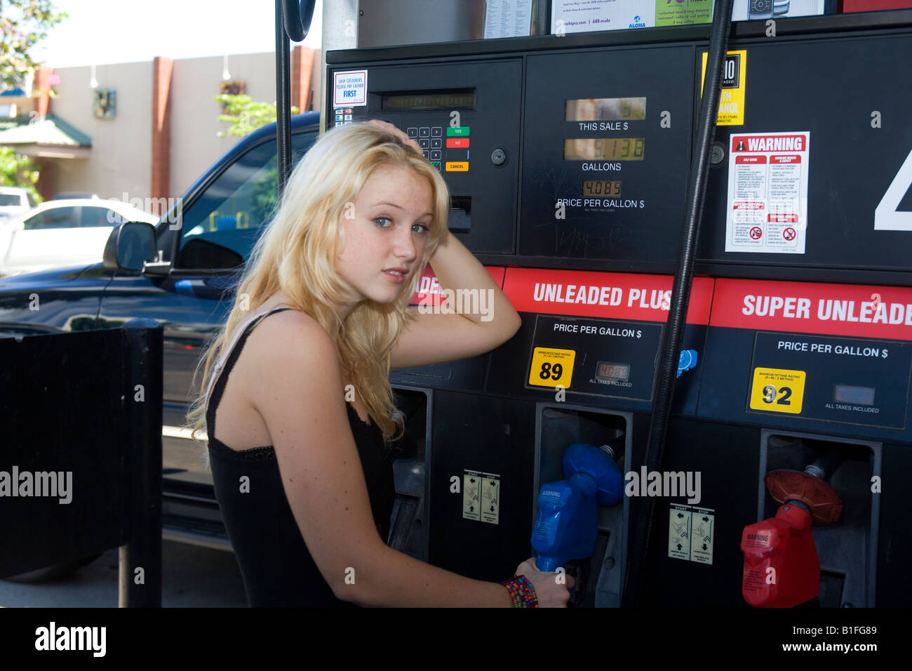 teenage girl at the gas station Stock Photo - Alamy