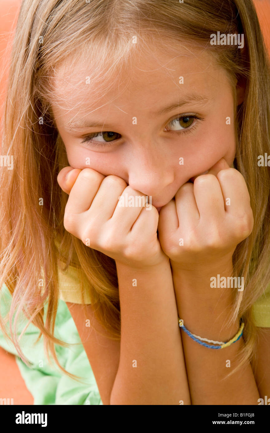 young blonde girl is looking anxious Stock Photo - Alamy