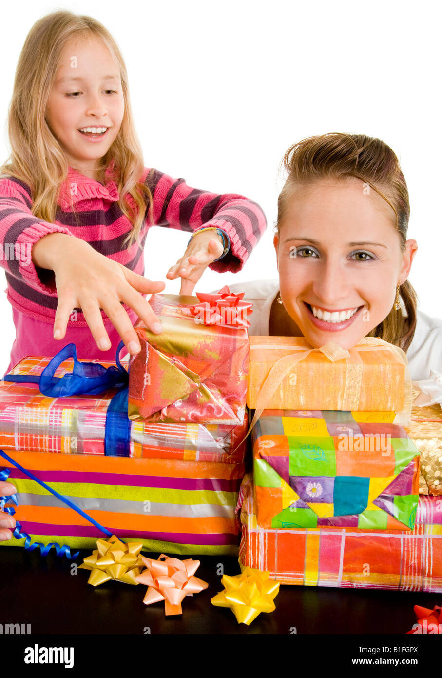 young girl and her mother are packing gifts Stock Photo - Alamy