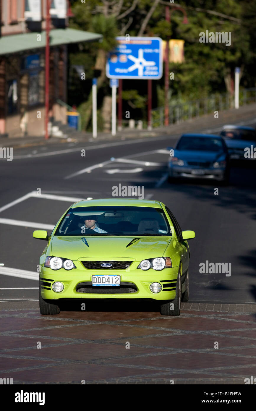 Green Ford falcon going over a speed bump at Titirangi Village Stock ...