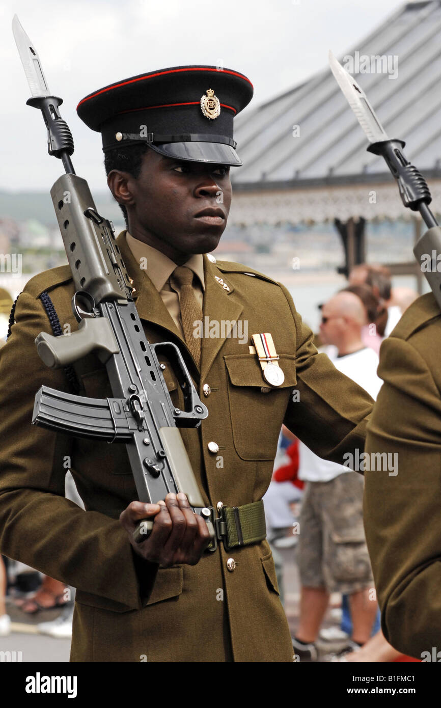 Black Soldier in the British Army marching with his Rifle in a welcome ...