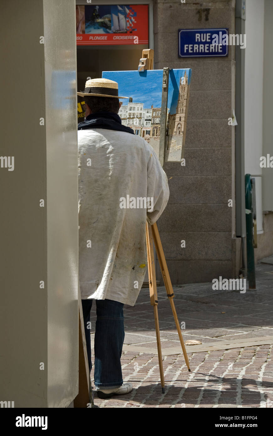 Stock photo of a street artist in limoges France He is painting a view ...