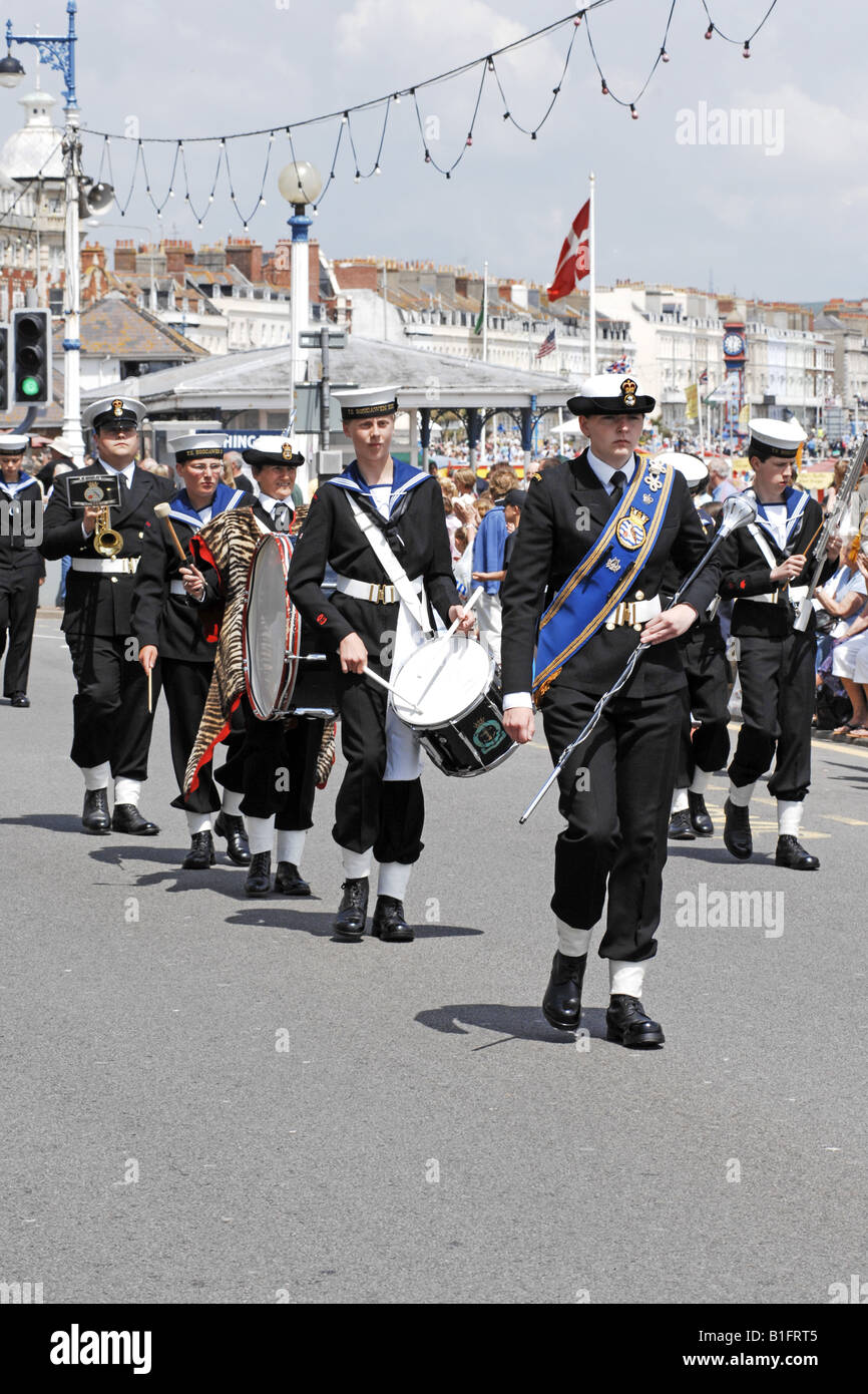 Men and Women of the Royal Navy march through the streets of Weymouth ...