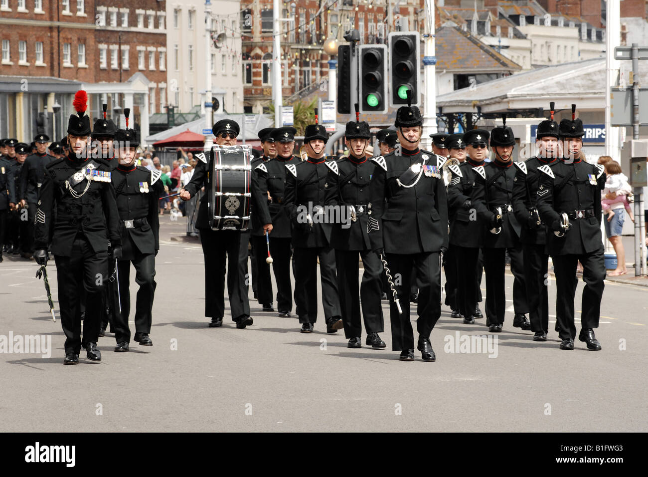 Band of the British Army Light Infantry march through the streets of ...