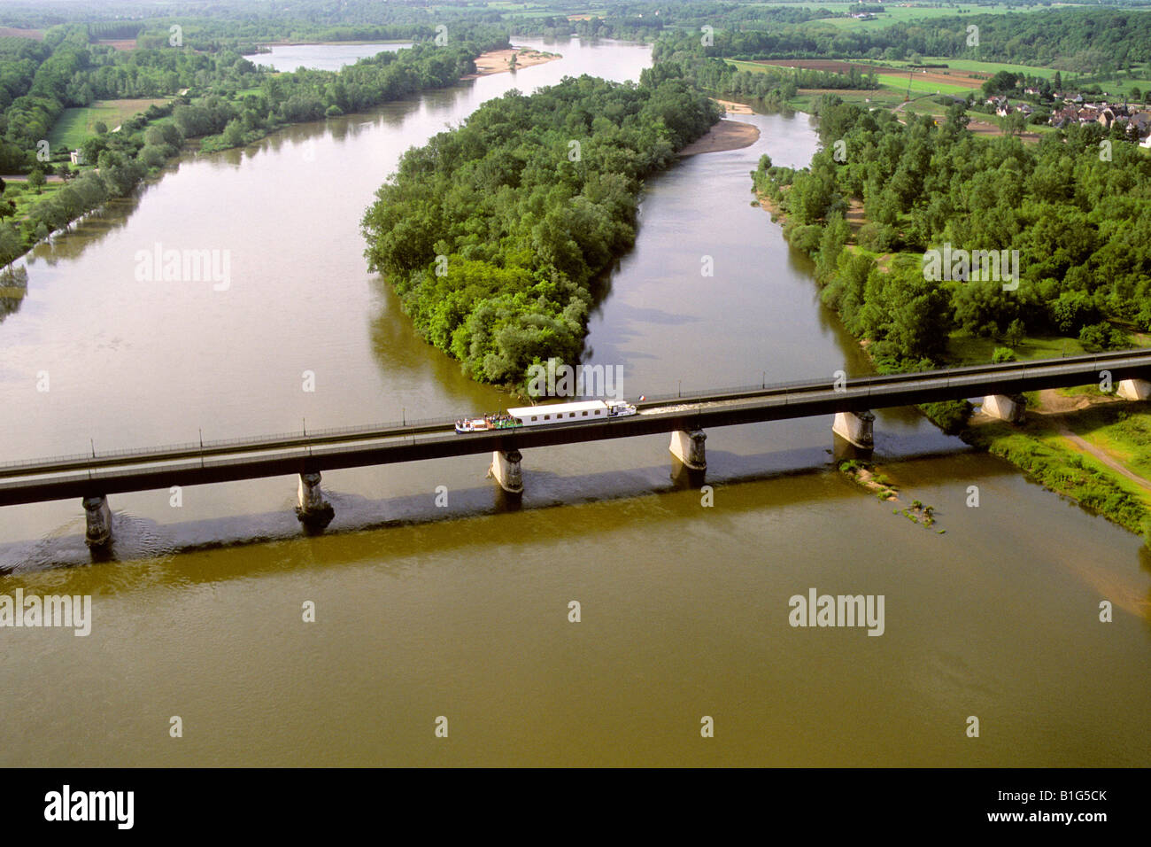 France, Loire. Luxury hotel barge on Pont Canal de Briare which crosses ...
