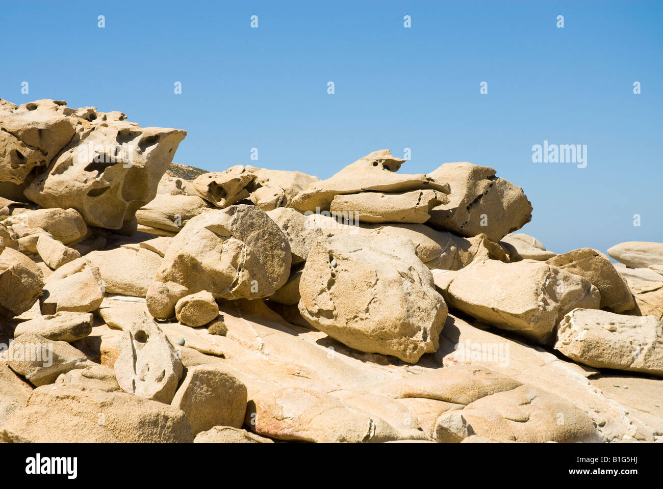 Coastal rock formations at Livada Beach Tinos Greece Stock Photo - Alamy