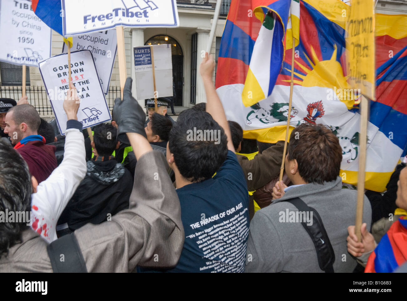 Protesters, placards and Tibetan flags at vigil opposite Chinese ...