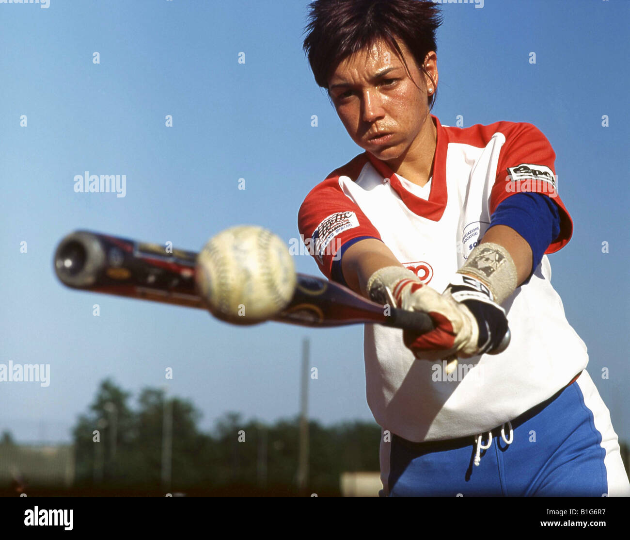 Front view of a woman playing baseball Stock Photo - Alamy