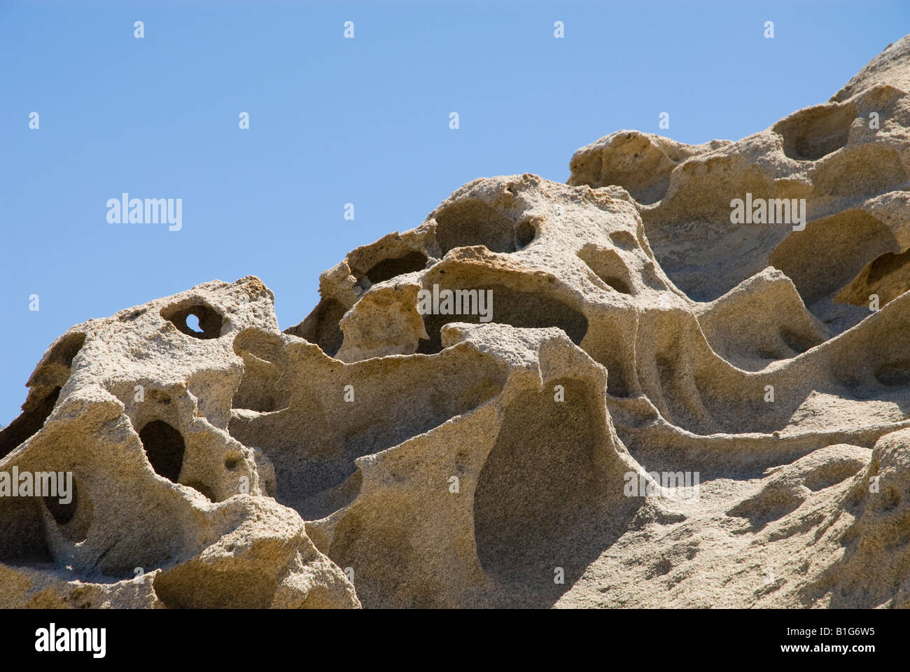 Coastal rock formations at Livada Beach Tinos Greece Stock Photo - Alamy