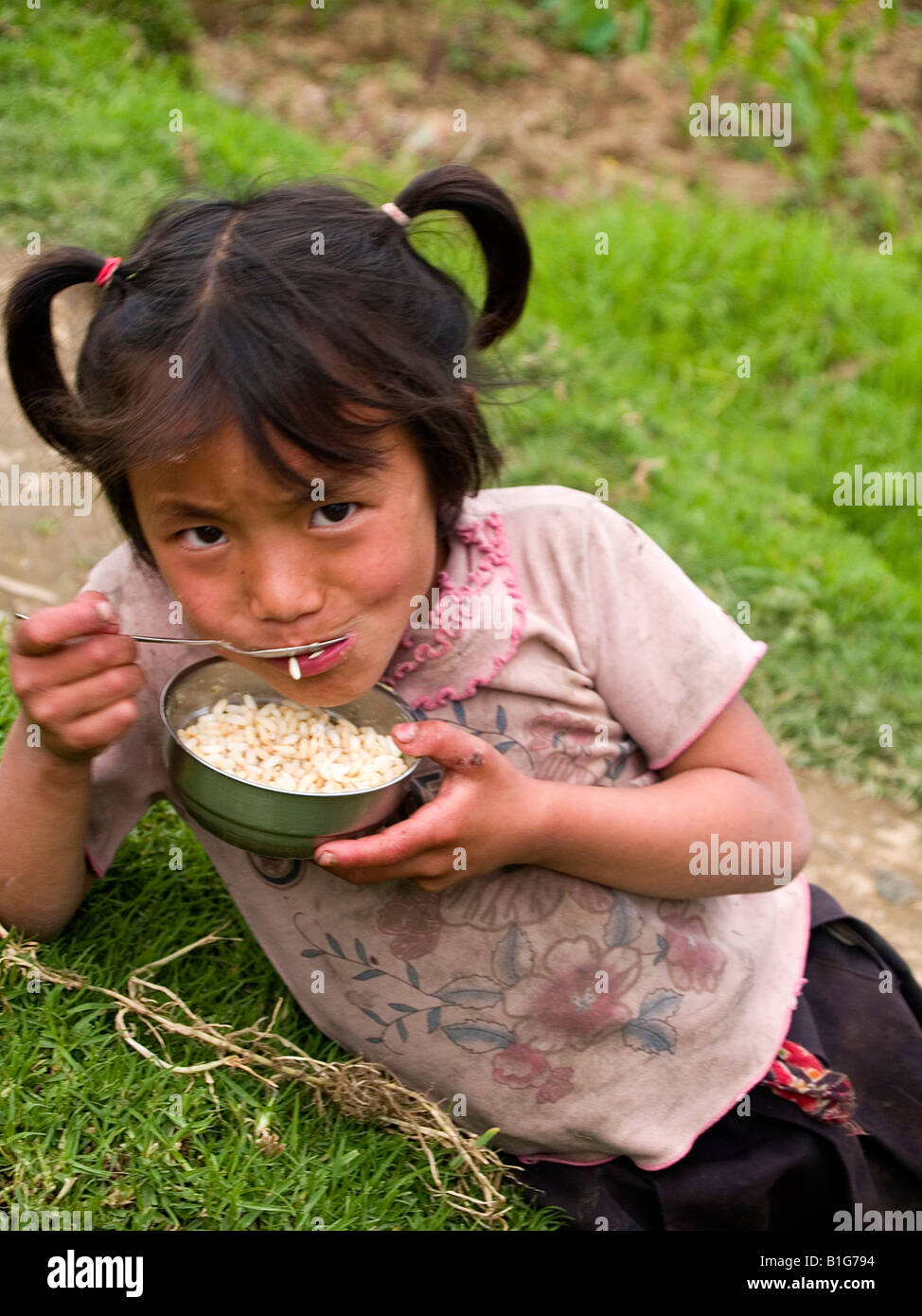 girl in Sikkim eating breakfast Stock Photo - Alamy