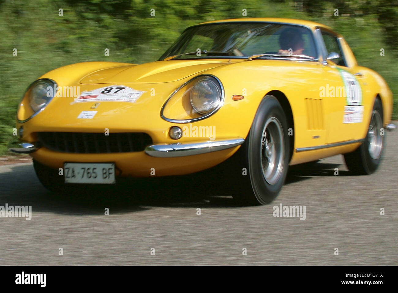 A person driving yellow car Stock Photo - Alamy