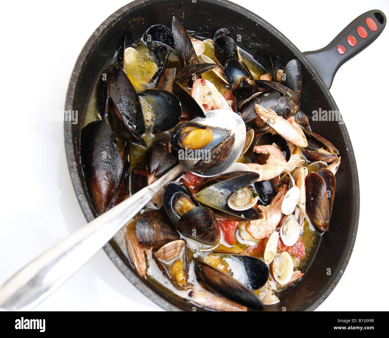 Close up view of a cooked mussels in a frying pan Stock Photo - Alamy