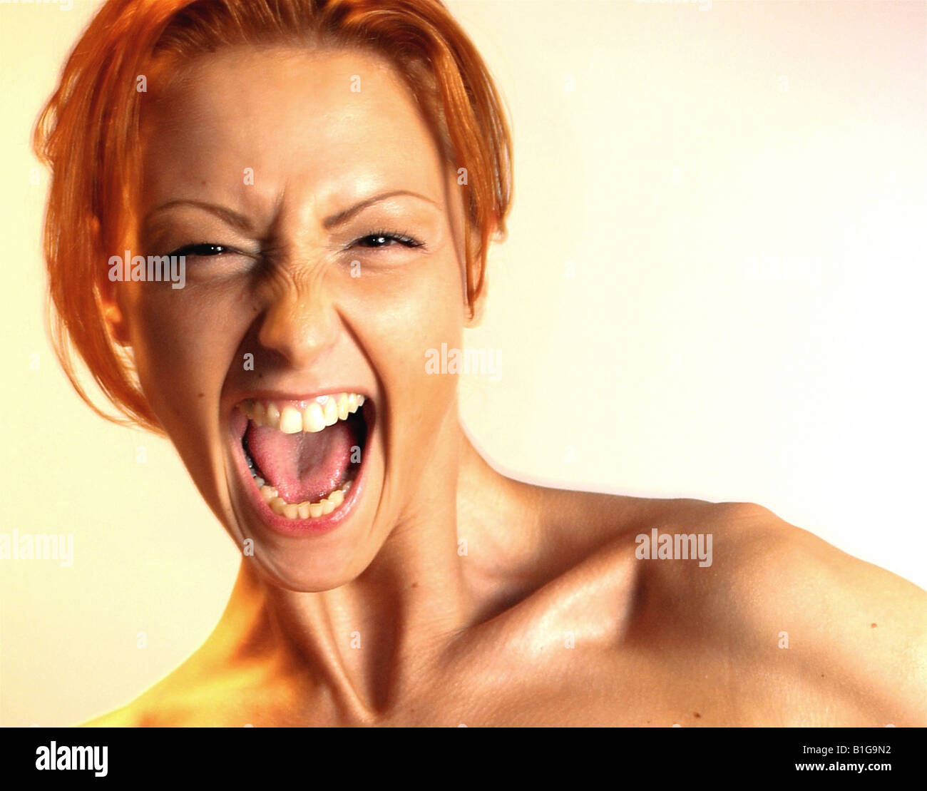 Front view of a crazy woman looking at camera Stock Photo - Alamy