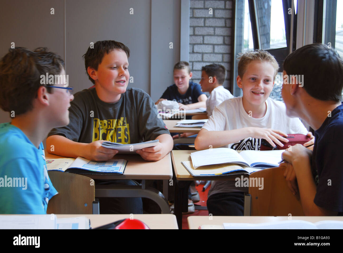 schoolboys in class chatting Stock Photo - Alamy