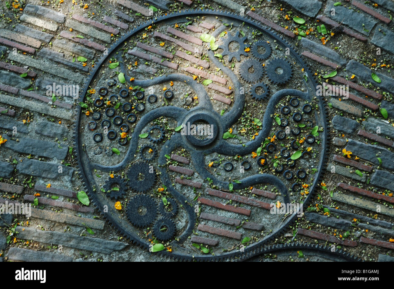 A decorative Gear Wheel inset with cogs and small gear wheels embedded ...