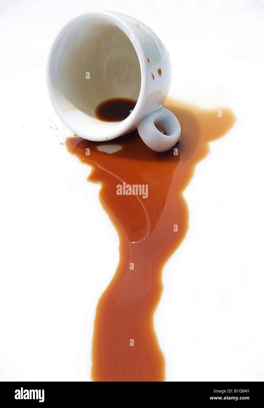 Black tea spilling from teacup Stock Photo - Alamy