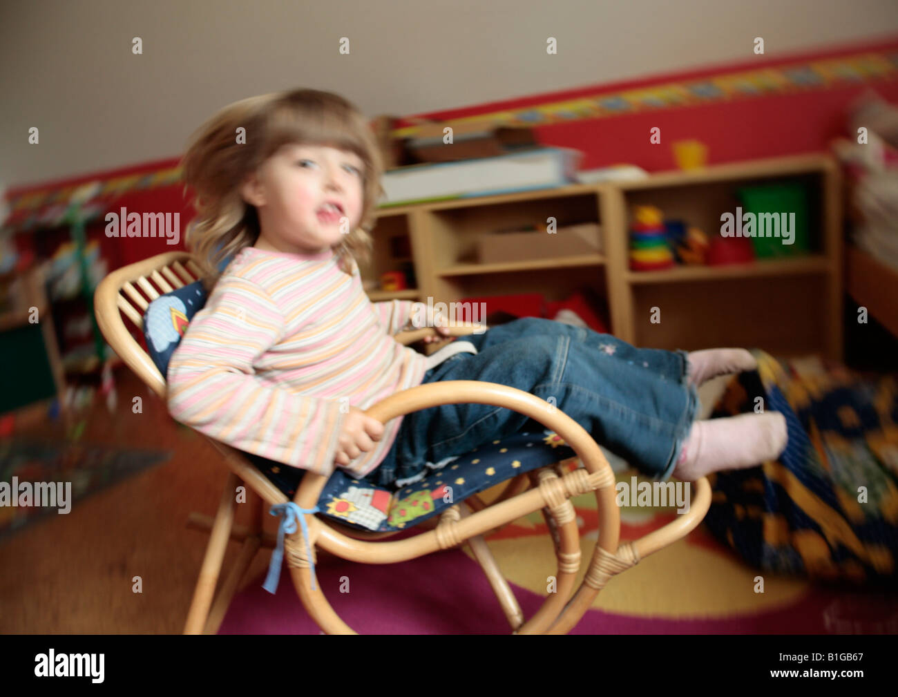 young girl rocking on a rocking chair Stock Photo - Alamy young girl rocking on a rocking chair Stock Photo - Alamy