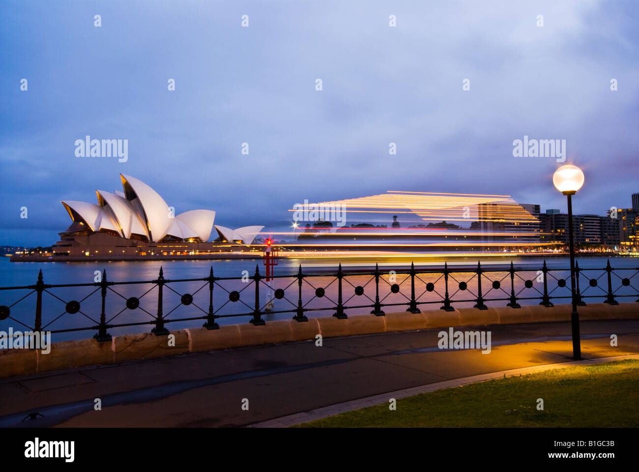 Overlooking Sydney Opera House as a cruise ship departs giving a ghost ...