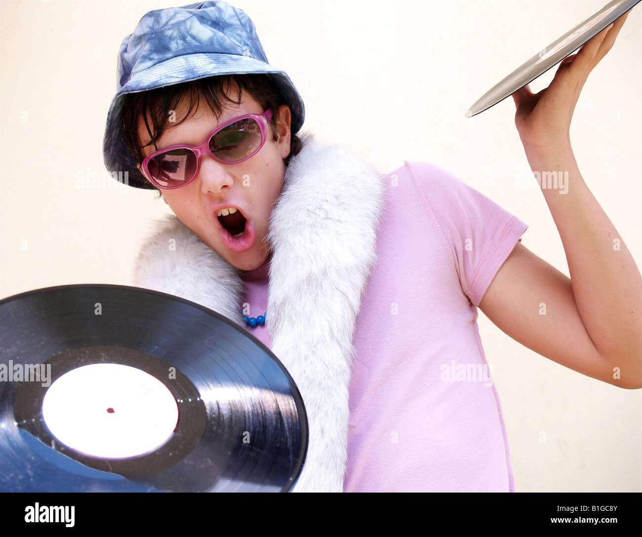 Close-up view of disc jockey holding disks Stock Photo - Alamy