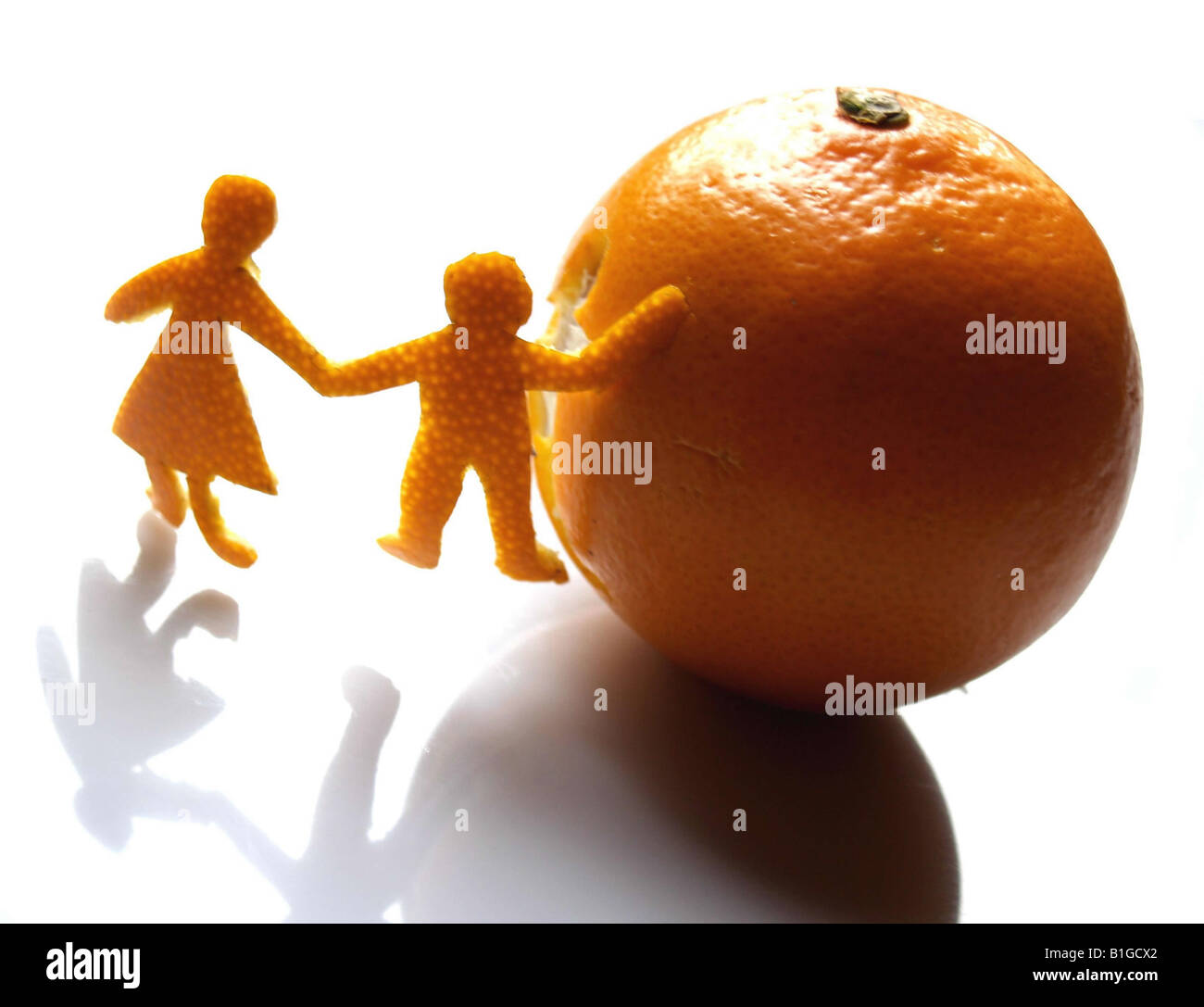 Human figure with orange Stock Photo - Alamy