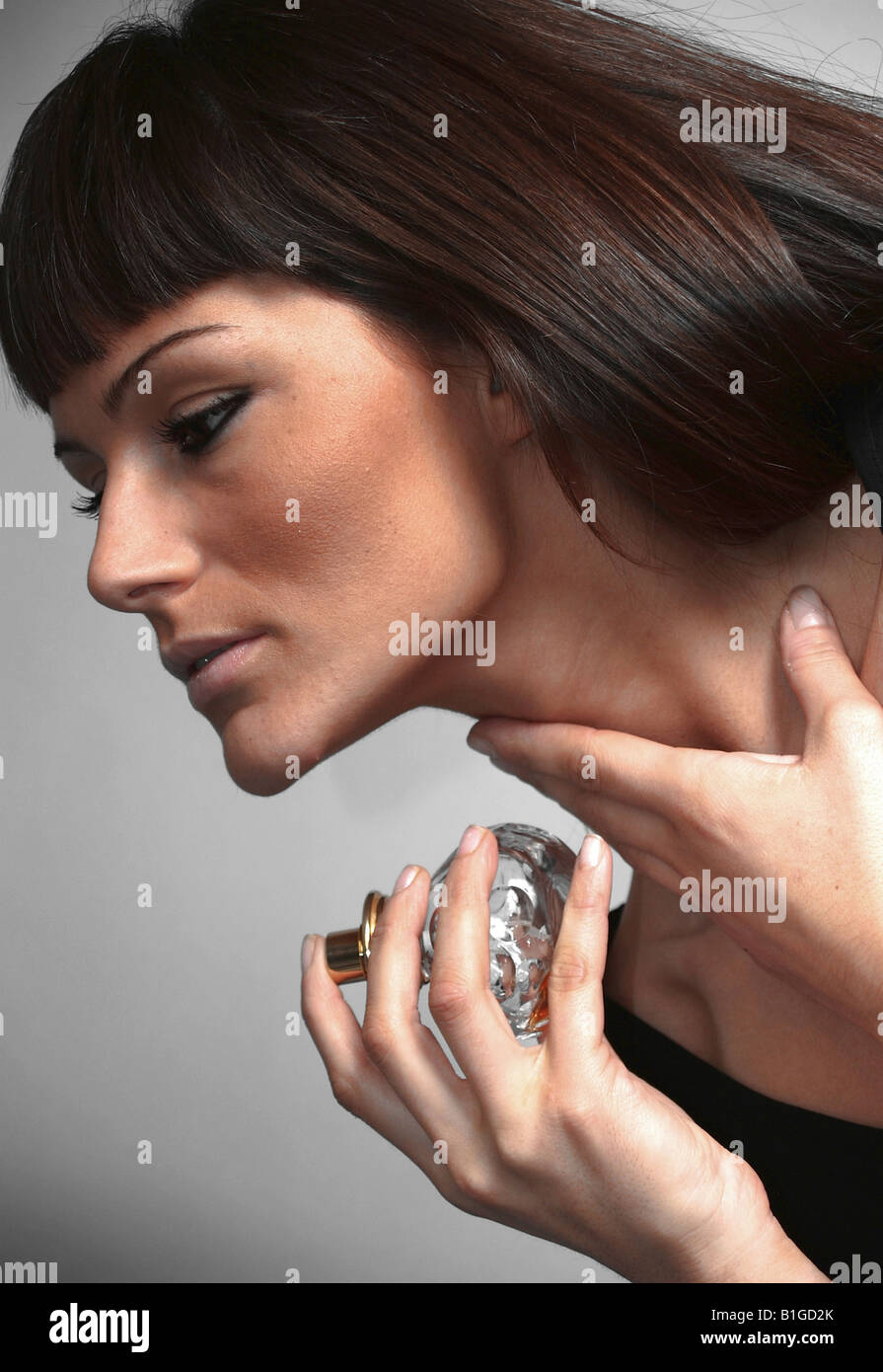 Woman spray perfumes hi-res stock photography and images - Alamy