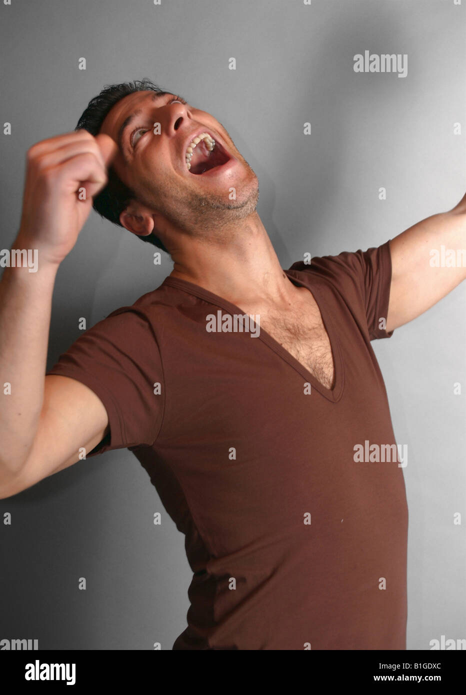 Front view of a young excited man Stock Photo - Alamy